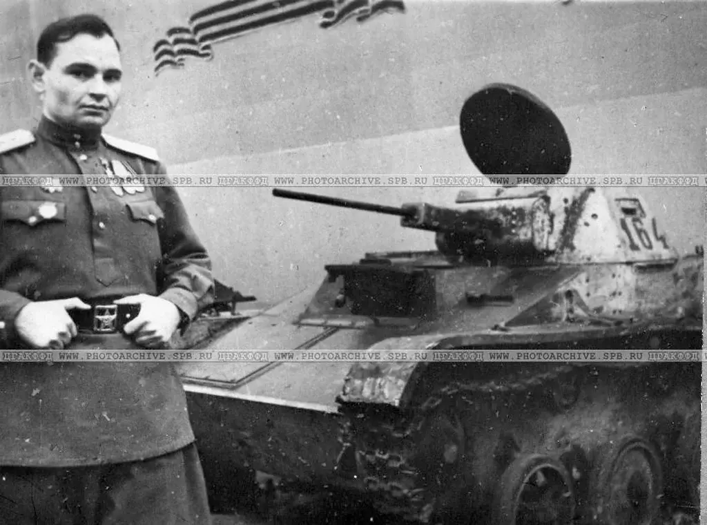 Oshaluk on the background of his tank, post-war photo. The car had a thickened housing and shielded tower