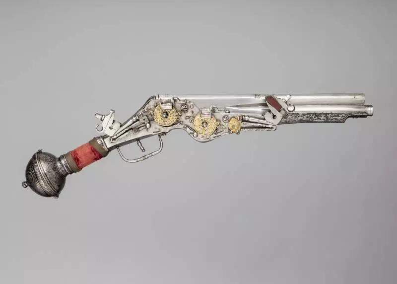 Double-Barreled Pistol uit Augsburg, ca. 1580 Materiaal: ijzer, messing, fluweel. Afmetingen: totale lengte 54 cm; De lengte van de bovenste stam is 31,6 cm; Lengte van de onderste stam van 27,3 cm; kaliber van het bovenste vat 12.1 mm; kaliber van de onderste stam van 12,7 mm; Gewicht van 2401.2 Metropolitan Museum, New York